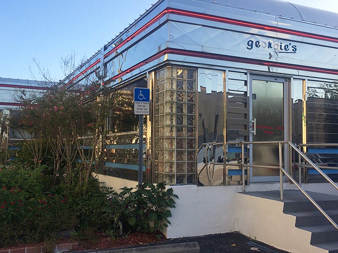 The gleaming stainless steel exterior of Georgie's Diner catches the Florida sunshine like a time machine waiting to transport hungry visitors back to the 1950s.