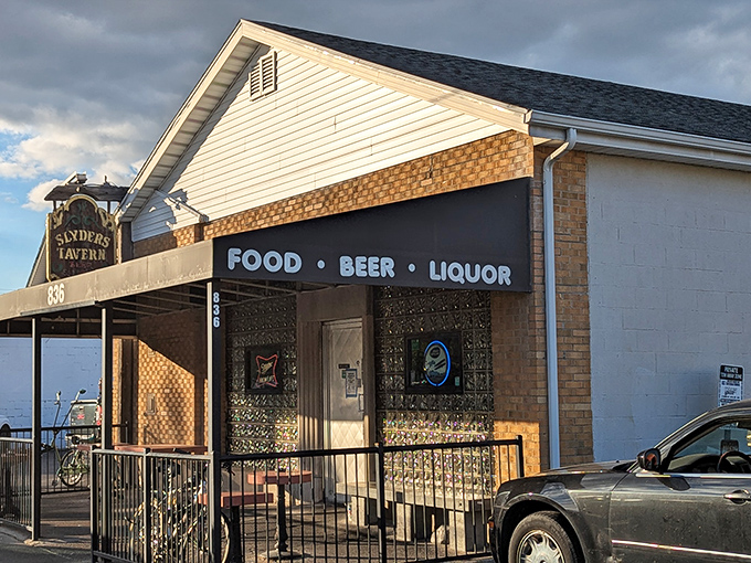A different angle reveals Slyder's true priorities: FOOD &bull; BEER &bull; LIQUOR, the holy trinity of neighborhood tavern perfection.
