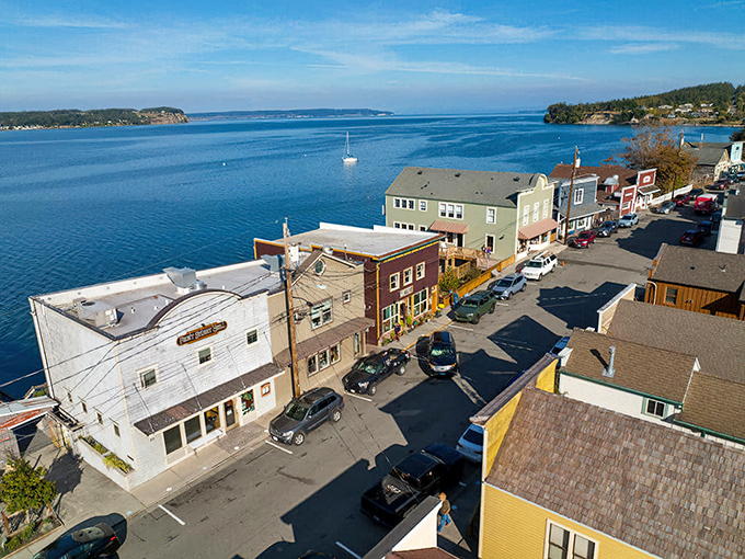 Front Street hugs the shoreline like it's afraid of missing the view, with colorful buildings that have witnessed over a century of island stories.