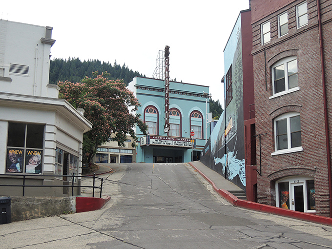 The historic California Theatre stands proudly in downtown Dunsmuir, a teal-colored time capsule nestled between brick buildings and mountain views.