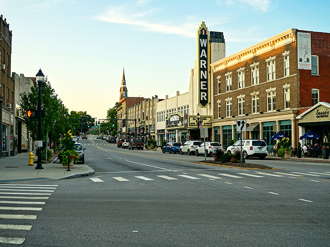 The Warner Theatre's iconic vertical sign has been guiding budget-conscious culture lovers to affordable entertainment since the Art Deco era.