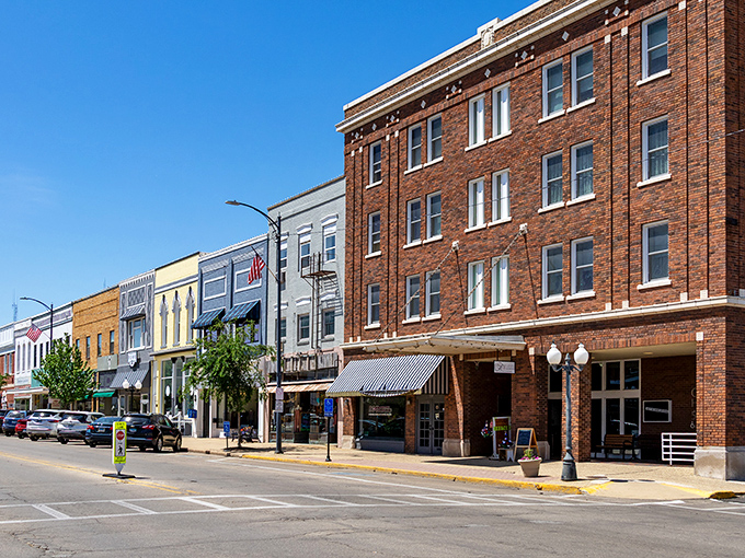 The colorful storefronts of Princeton's downtown district create a vibrant tapestry of small-town commerce where local businesses thrive in buildings that have witnessed over a century of history.