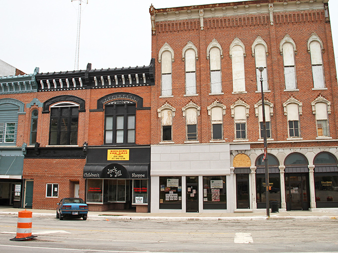 Historic brick buildings line Frankfort's Main Street, where local shops have survived decades without succumbing to the chain store apocalypse.