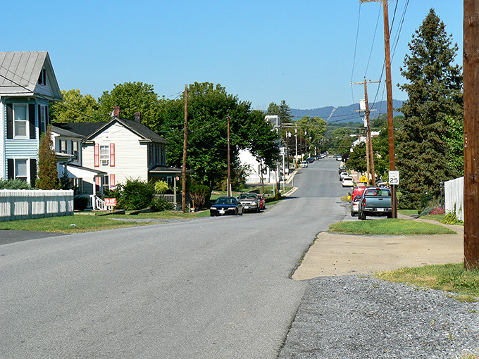 Quintessential small-town America unfolds along this peaceful Strasburg street, where historic homes stand as silent witnesses to centuries of Shenandoah Valley life.