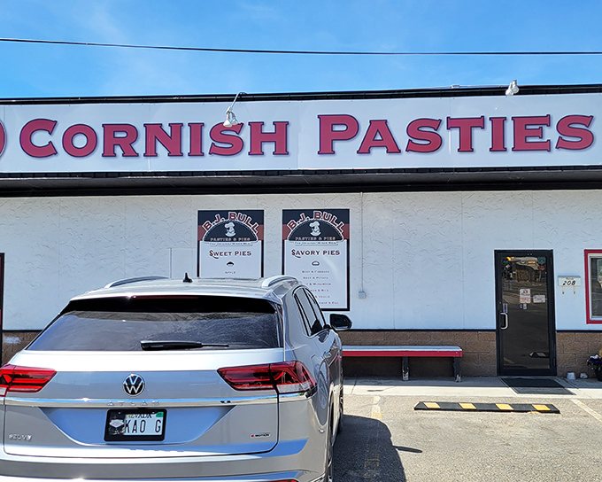 The unassuming storefront might not scream "culinary destination," but that red Cornish Pasties sign is basically a bat signal for hungry travelers.