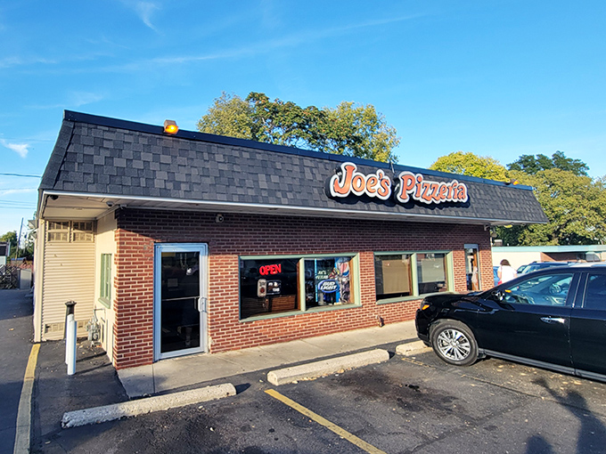 The unassuming brick exterior of Joe's Pizzeria stands like a time capsule on Airway Road, promising pizza perfection without pretension.