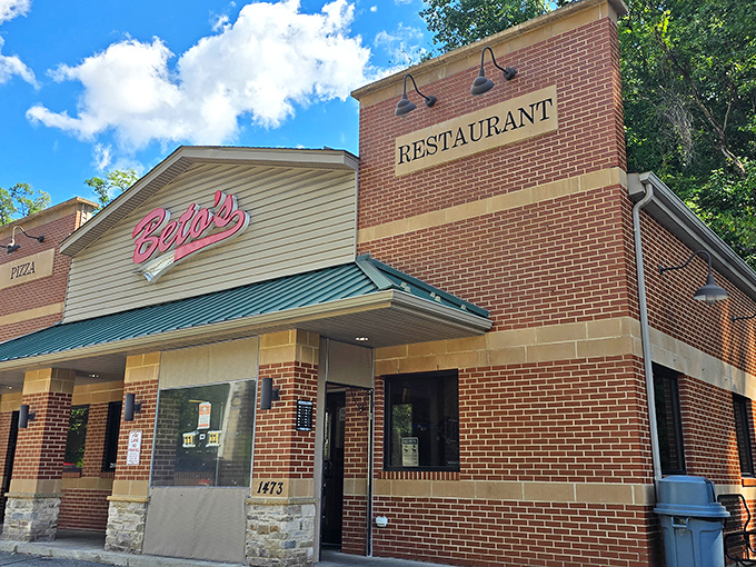 The unassuming brick exterior of Beto's Pizza hides a culinary rebellion that's been challenging pizza norms for decades. Pizza pilgrims, your destination awaits!