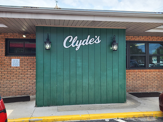 The iconic green facade of Clyde's Restaurant stands as a beacon of culinary promise in Waynesville, where simplicity and flavor have found their perfect home.