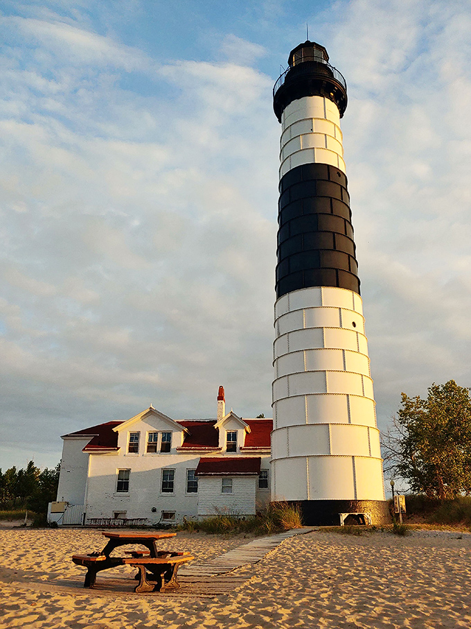 Golden hour transforms this 112-foot maritime sentinel into a postcard-perfect scene. The keeper's quarters below look cozy enough to book on Airbnb.