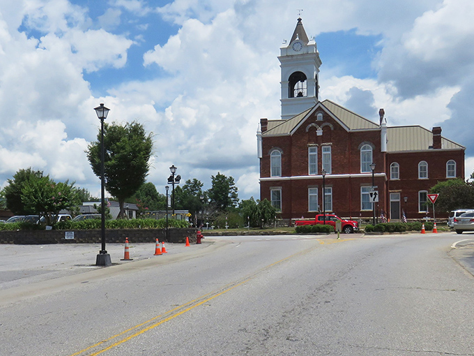 The historic Union County Courthouse stands like a Victorian sentinel, watching over Blairsville with its distinctive clock tower and red brick charm.
