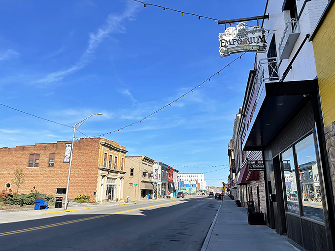 Mercer Street's historic storefronts bask in brilliant blue skies, where the Emporium sign dangles like an invitation to simpler times and affordable treasures.