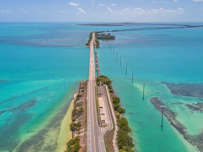 The ultimate road trip fantasy—a ribbon of asphalt seemingly floating between two impossible shades of blue. Mother Nature showing off again.