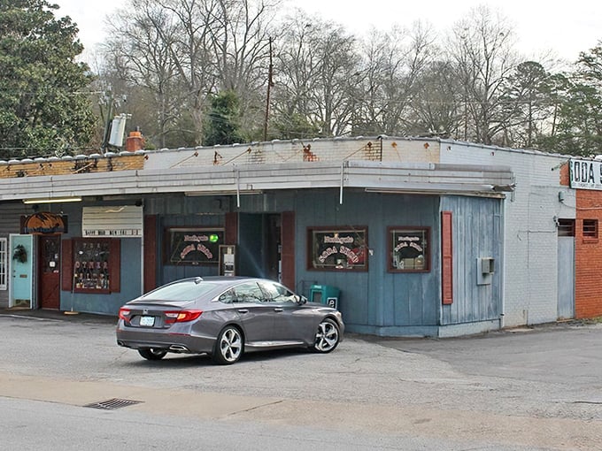 The unassuming blue exterior of Northgate Soda Shop stands like a time portal to 1950s America. No fancy frills, just honest-to-goodness culinary treasures waiting inside.