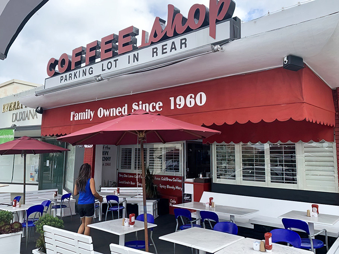 That iconic red awning with "COFFEE SHOP" in bold letters is like a beacon of breakfast hope in La Jolla's morning landscape.