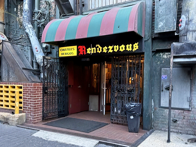 Not all treasures come with flashing lights. This unassuming alley entrance, with its vintage striped awning, hides one of America's most celebrated barbecue sanctuaries.