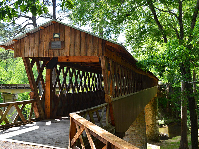 Like finding a wooden time machine in the Alabama woods, Clarkson Covered Bridge stands proudly against autumn's golden backdrop, inviting curious travelers to step into history.