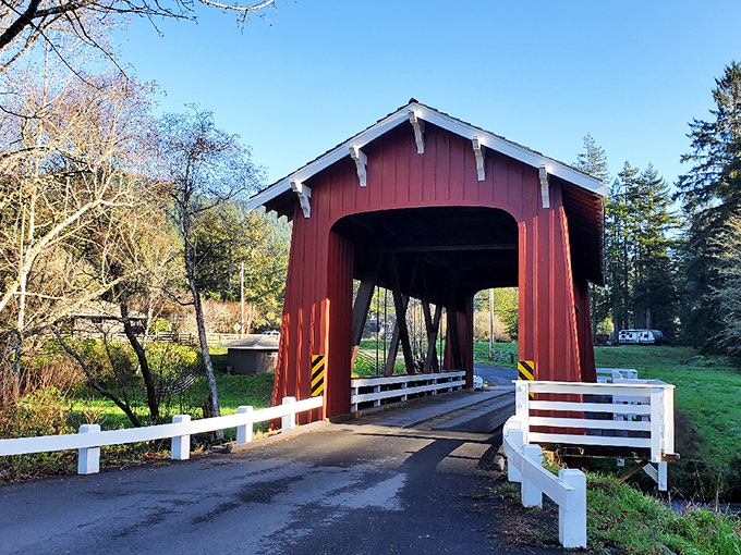 The crimson guardian of Bayside stands proudly against a perfect California sky, inviting travelers to slow down and experience a slice of architectural history.
