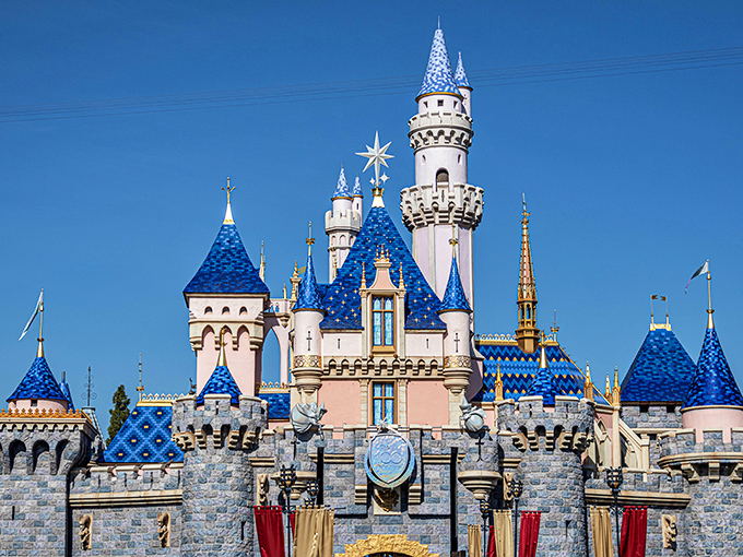 Sleeping Beauty Castle stands proudly against the California sky, its blue spires reaching toward dreams that never grow old.