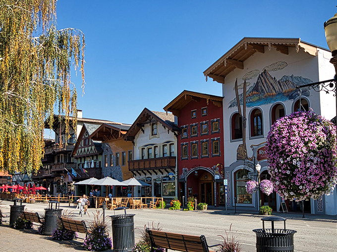 Bavarian-style buildings line Front Street in Leavenworth, where hanging flower baskets and mountain views create a scene straight from "The Sound of Music" – minus Julie Andrews.