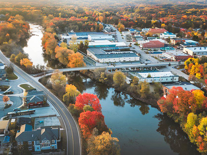 Fall foliage frames Windham's riverside district like nature's own Instagram filter, proving Connecticut doesn't need celebrities to create picture-perfect moments.
