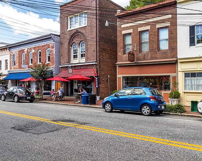 Brick facades and colorful awnings line Chestertown's main street, where small-town charm meets architectural splendor that's stood the test of time.