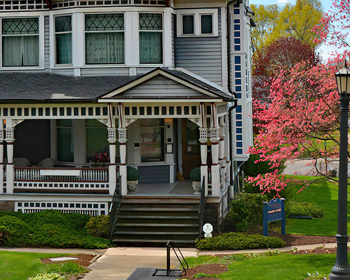 The grand entrance to Victorian splendor – where modern stress dissolves faster than an aspirin in hot tea. Those bay windows practically beg you to sit and gossip about the neighbors.