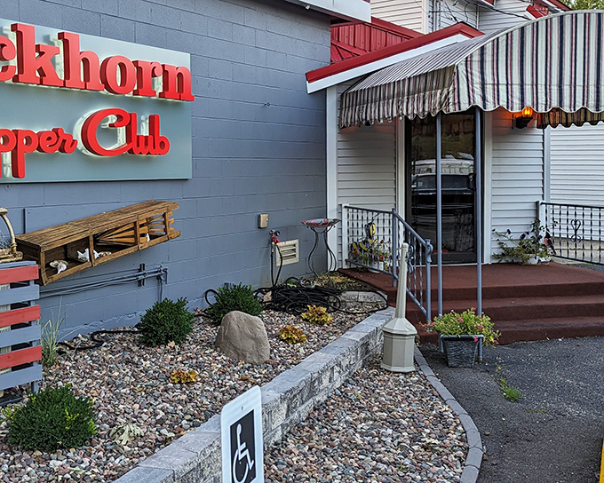 The iconic red lettering against blue-gray siding isn't just a sign&mdash;it's a beacon of hope for hungry travelers seeking Wisconsin's supper club salvation.
