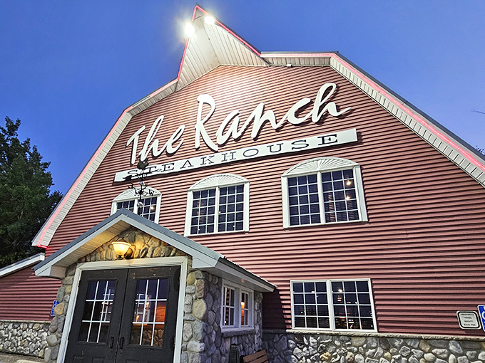 As dusk settles, The Ranch Steakhouse glows like a beacon of culinary promise, its distinctive barn silhouette a landmark for locals and visitors alike.