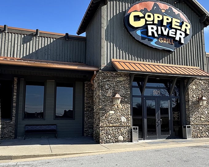 The rustic stone and timber exterior of Copper River Grill stands like a mountain lodge transplanted to Kentucky, promising warmth and hearty meals within.