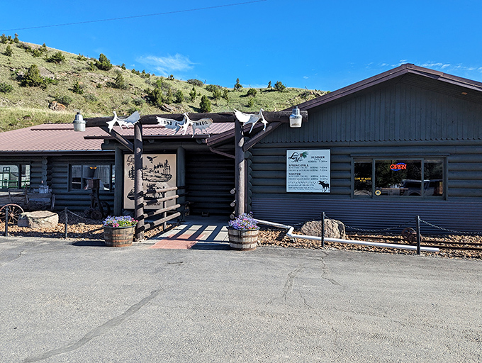 Welcome to the Land of Magic, where rustic charm meets culinary wizardry. This log cabin exterior promises a feast for both your eyes and taste buds!