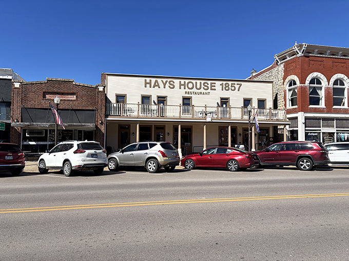 The iconic white facade of Hays House 1857 stands proudly on Council Grove's main street, a living postcard from America's frontier days.