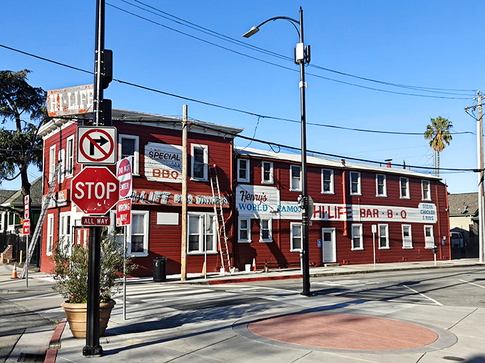 The iconic red exterior of Henry's World Famous Hi-Life stands out like a culinary lighthouse in San Jose, beckoning hungry travelers with promises of legendary barbecue.