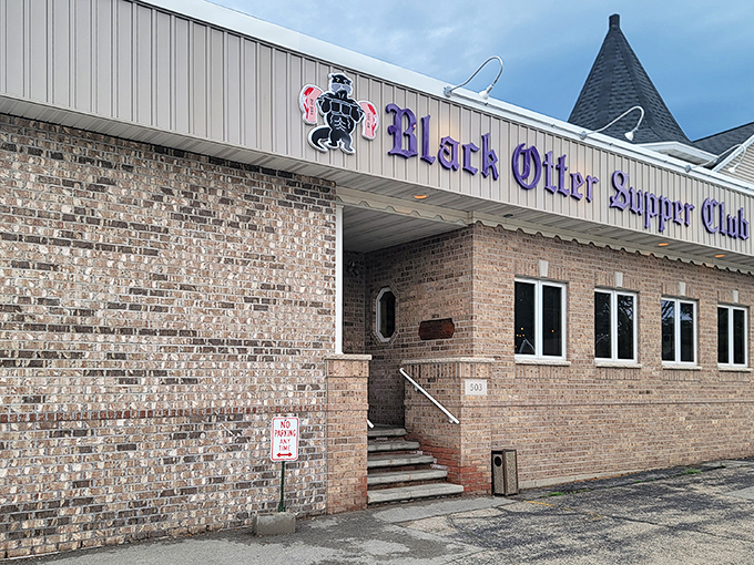 The purple signage of Black Otter Supper Club glows against the brick exterior like a beacon for hungry travelers&mdash;Wisconsin's version of the North Star.