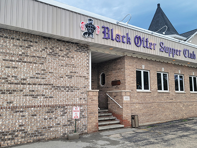 The brick facade of Black Otter Supper Club stands like a beacon of comfort in Hortonville, promising carnivorous delights within those unassuming walls.