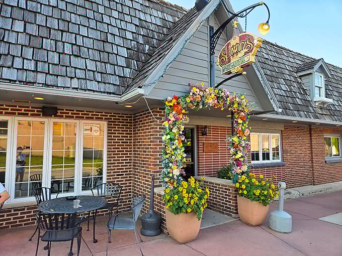 The floral archway at Schwarz's isn't just decoration&mdash;it's a portal to prime rib paradise. Wisconsin supper club magic awaits beyond those blooms.