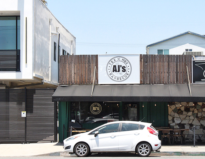 The unassuming storefront of AJ's might not stop traffic, but that heavenly smoke aroma certainly will. Valley Village's best-kept secret hides in plain sight.