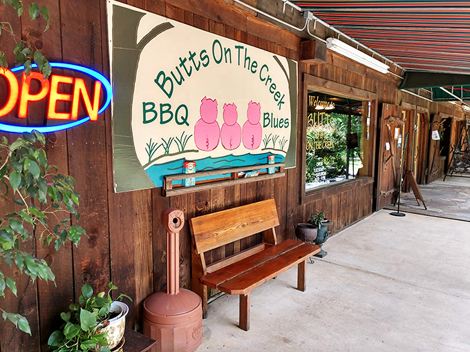 Three pink pig bottoms on a whimsical sign say it all&mdash;this isn't your ordinary BBQ joint. Welcome to flavor country!