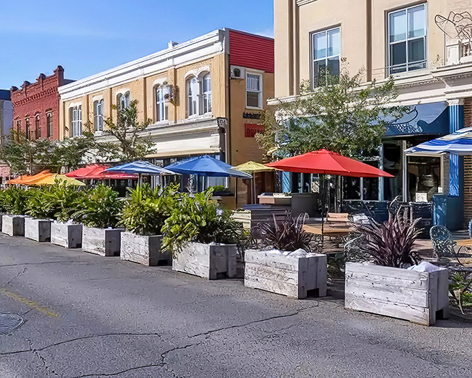 Colorful umbrellas dot Ellington's charming downtown, where local eateries offer outdoor dining perfect for retirees enjoying Connecticut's pleasant seasons.