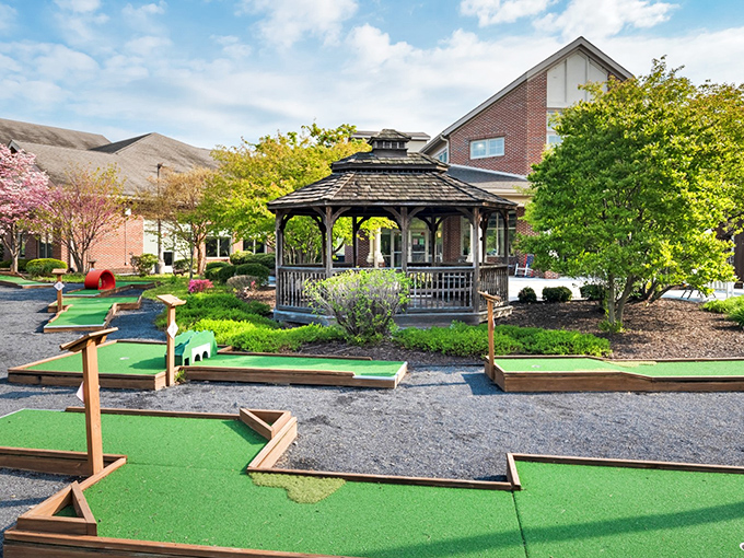 Who needs a country club when you've got a miniature golf course and a gazebo that looks like it belongs in a Norman Rockwell painting?