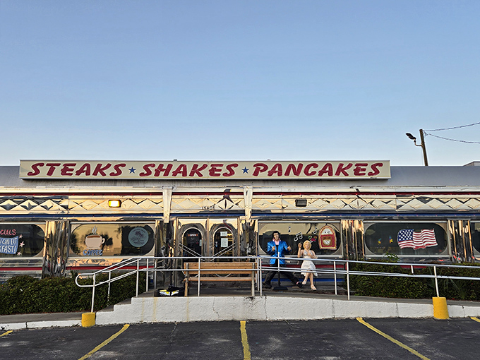The gleaming chrome exterior of All American Diner catches Florida sunshine like a time machine to simpler days.