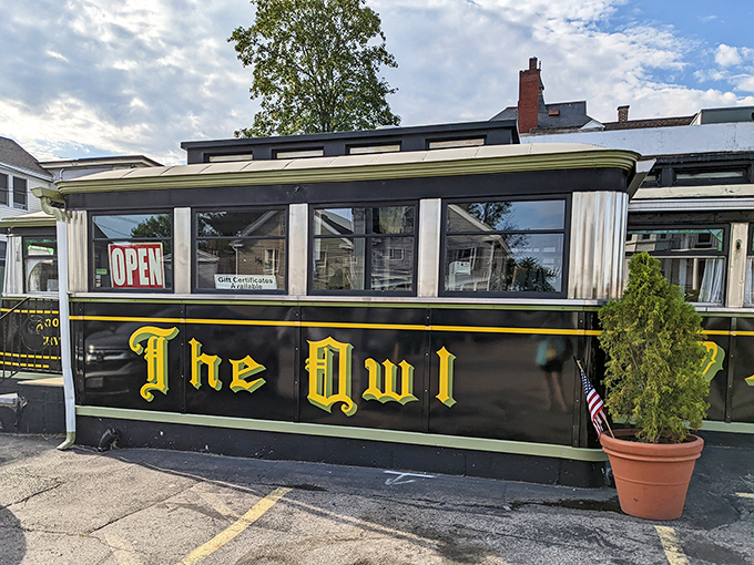 The iconic black and yellow exterior of The Owl beckons like a time machine to the golden age of American diners. No filter needed on this classic.