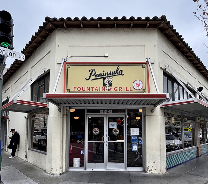 That classic Peninsula Fountain & Grill storefront beckons like a time capsule of American dining perfection.
