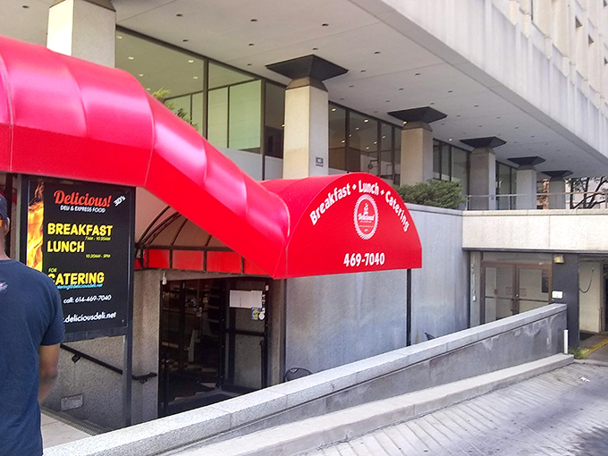 That bold red awning beckons like a lighthouse guiding hungry sailors to their corned beef destiny.