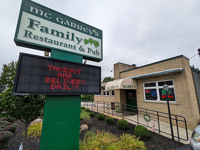 The green and white sign of McGarrey's stands like a beacon of hope for hungry travelers. This unassuming exterior promises culinary treasures within.
