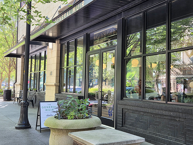 The elegant storefront beckons like an old friend, promising culinary treasures behind those gleaming windows and understated signage.
