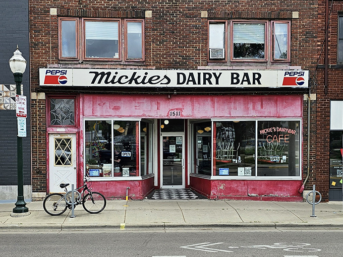 Time stands still at Mickey's exterior, where the faded pink walls and classic signage promise an authentic diner experience that's survived decades of changing food trends.