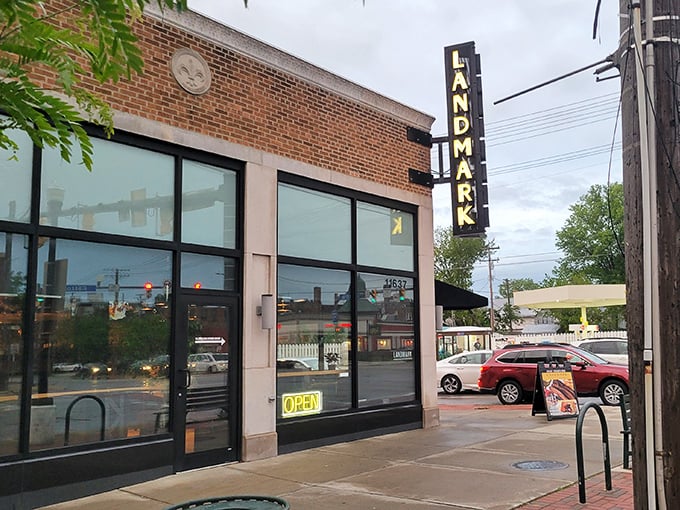 The brick facade of Landmark Smokehouse beckons like a carnivore's lighthouse, with its vertical sign promising smoky treasures within.