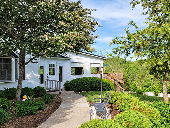 Manicured landscaping and a welcoming pathway invite you into this countryside gem, where steak perfection awaits beyond the white siding.