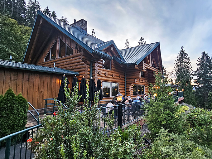 A woodland palace of culinary delights! Stone Cliff Inn's magnificent log cabin exterior promises rustic luxury before you even step inside.