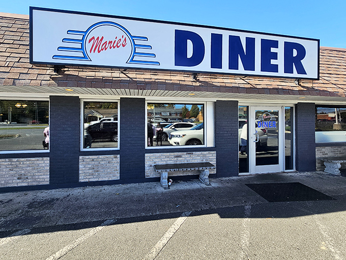 The iconic blue and white sign of Marie's Diner stands as a beacon of comfort food promise in La Plata, beckoning hungry travelers with retro charm.